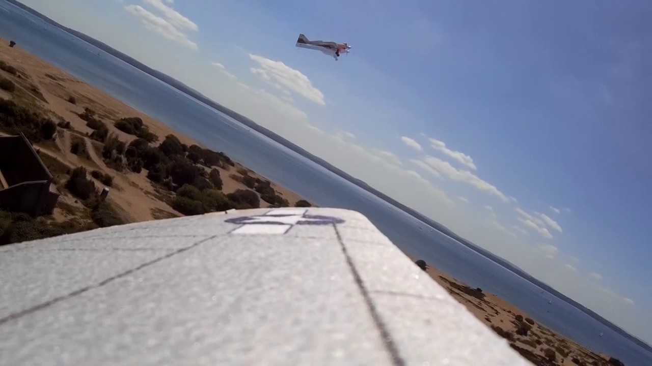 Two people flying something - YouTube