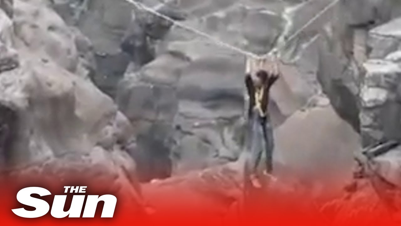 Heroic rescue shows man being pulled to safety after he fell down ...