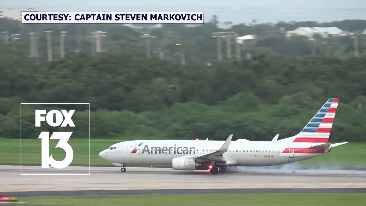 Plane tire catches fire during takeoff in Tampa - YouTube
