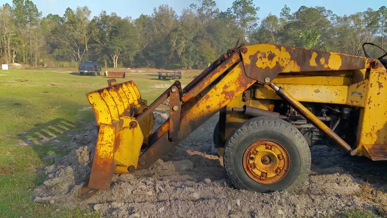 Massey Ferguson 302 with Root Rake. - YouTube