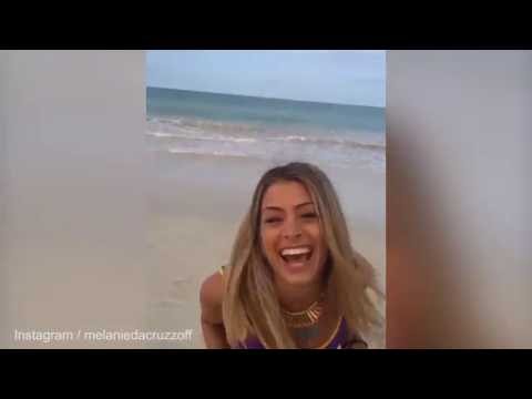 Melanie Da Cruz has a laugh with friends in Lakers swimsuit