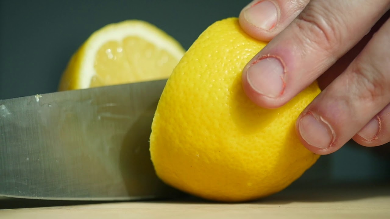 Cutting lemon in two halves in slow motion. Free HD video footage - YouTube