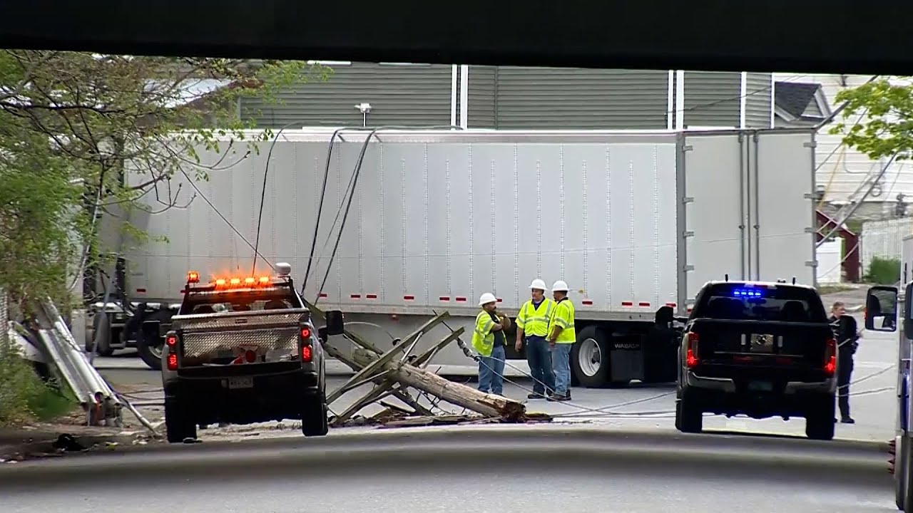 Power lines fall on Lowell Connector after utility pole snaps - YouTube