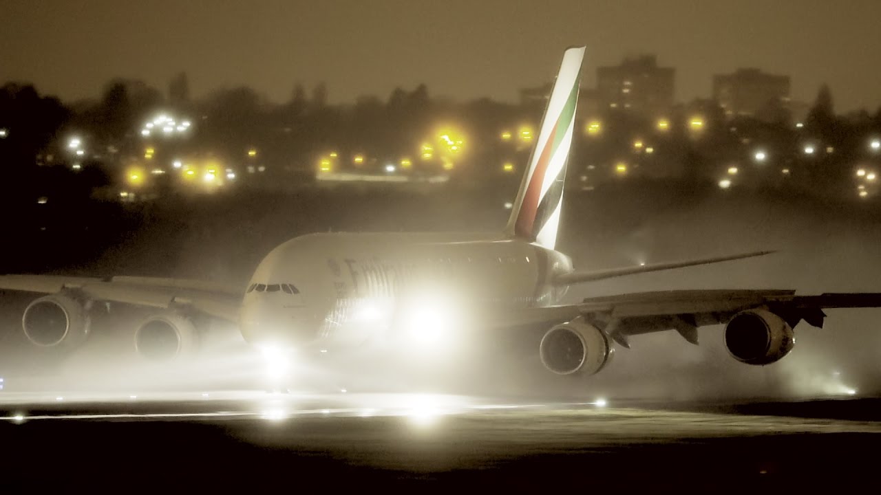 Emirates A380 - night arrival in heavy rain - YouTube