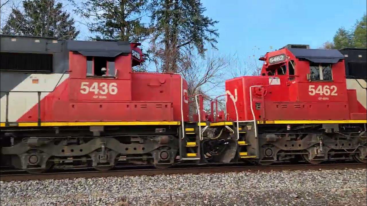 CN 5462, 5436 with long hoods facing out, taking the local freight train East to Battle Creek ...