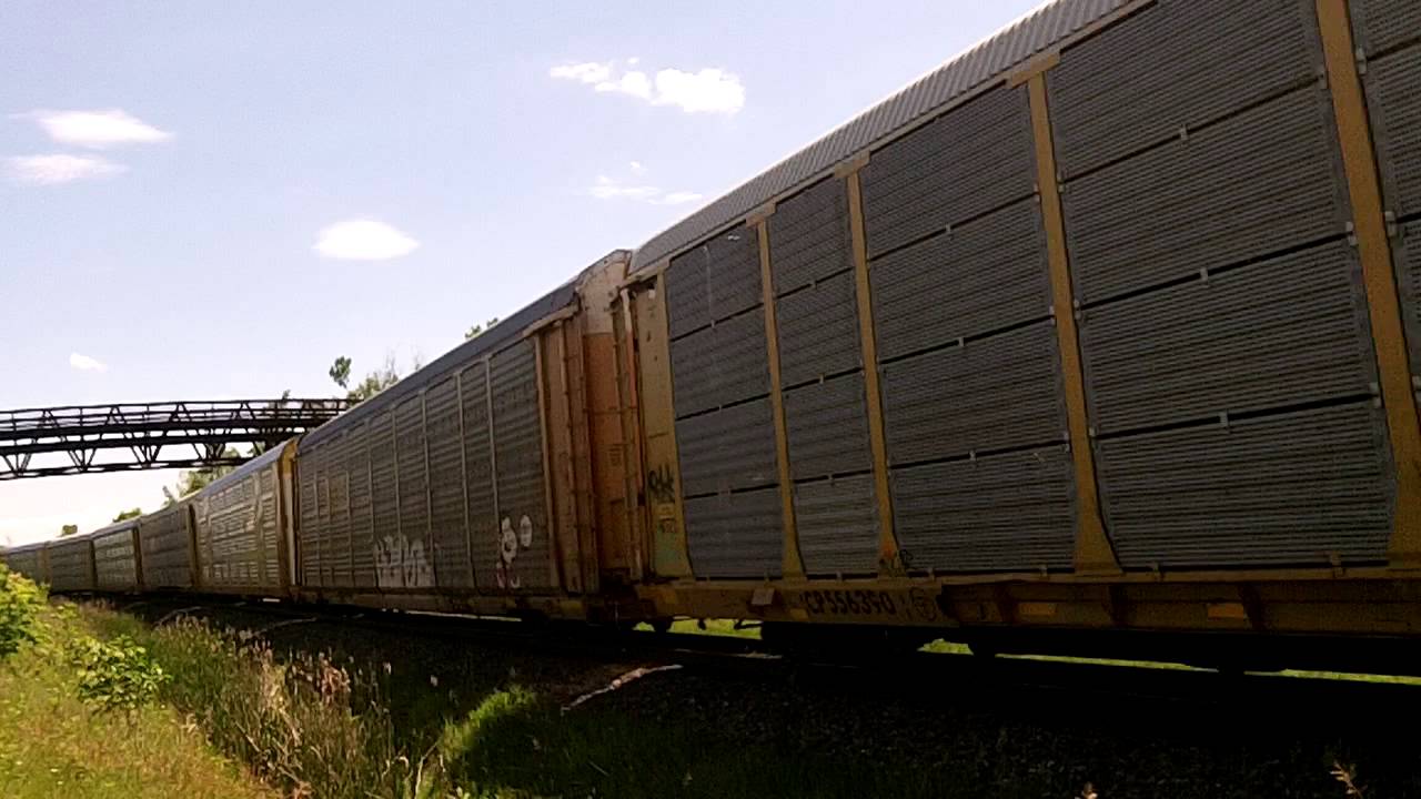CN 332 w/ IC 2697, CN 2516 & NS 9606 lead this long EB mixed/Autorack ...