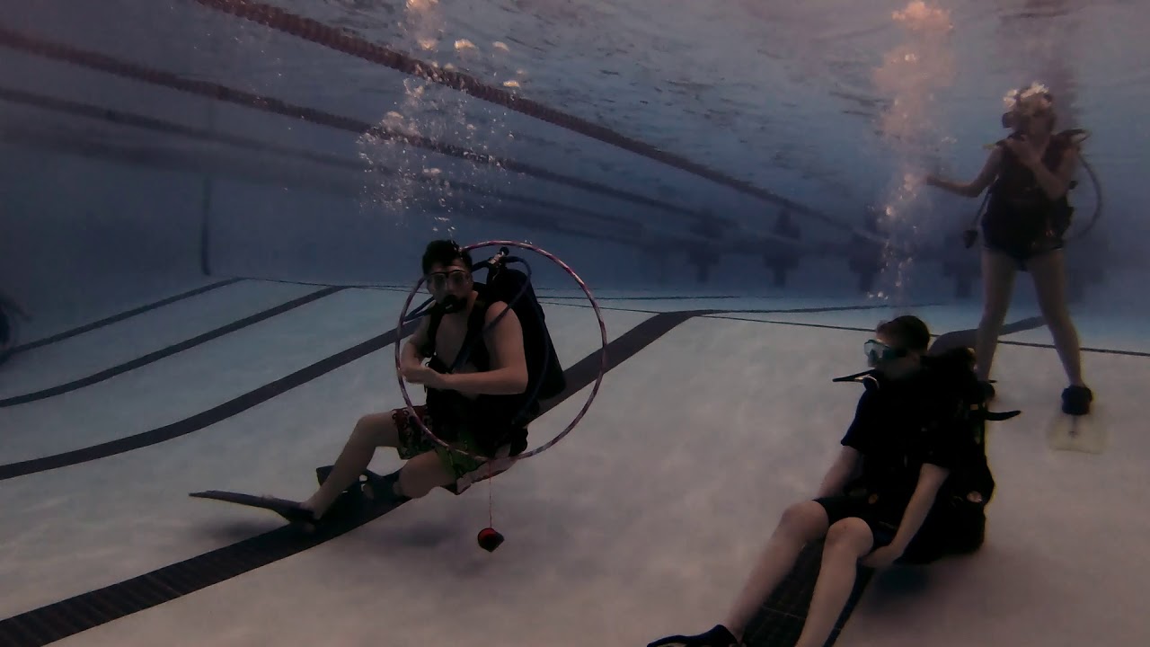 Gardner Webb practicing buoyancy using hula hoops in the pool. - YouTube