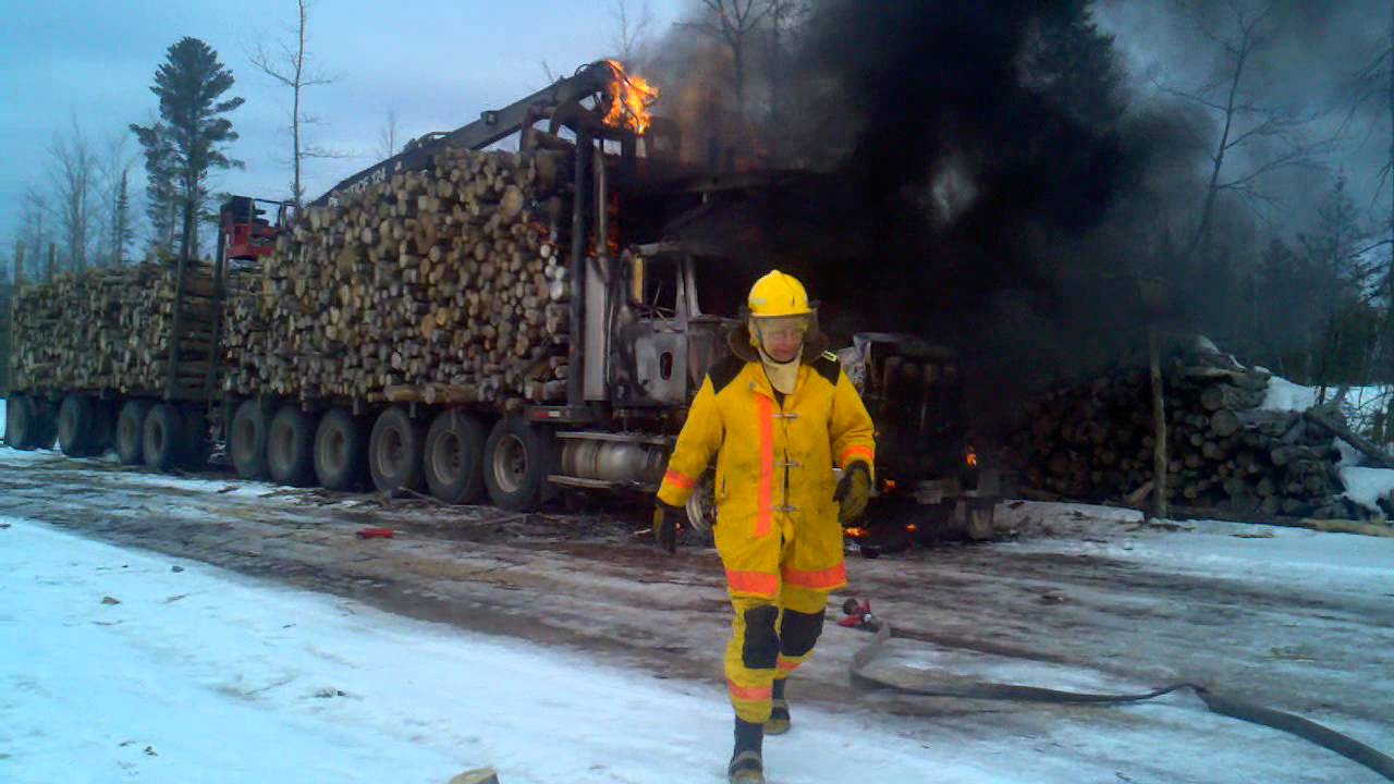Log truck on fire - YouTube