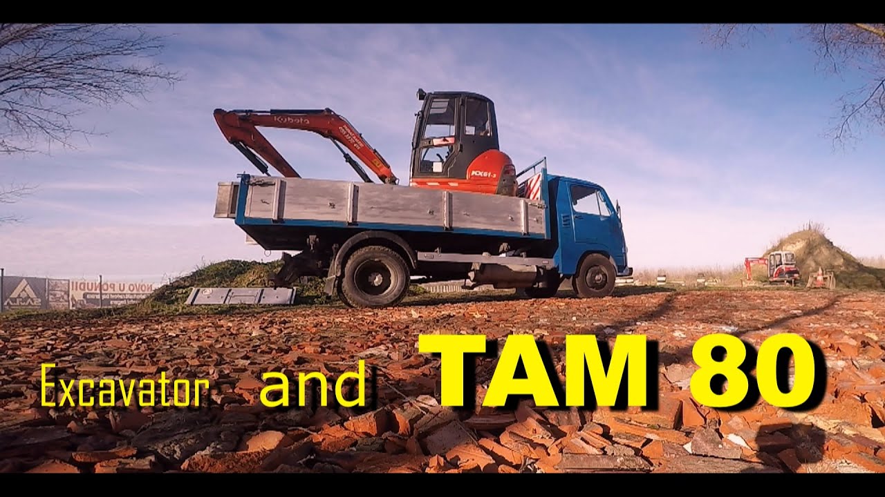 Load the excavator on truck TAM 80 - YouTube