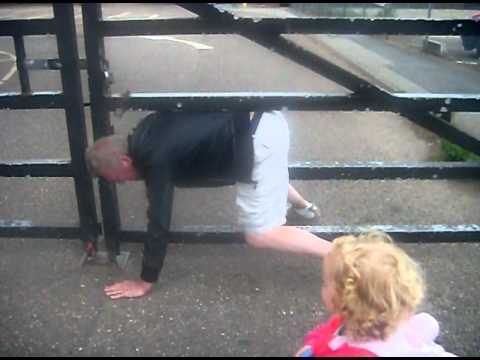 MAN STUCK IN GATE - YouTube