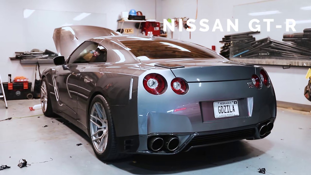 Godzilla GTR in for a forged carbon wrap on accents - YouTube