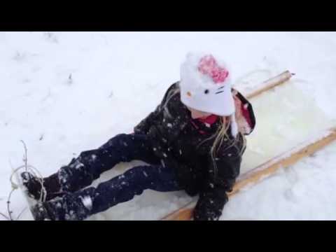 Sarabelle's Homemade snow sled out if a 55 gal barrel - YouTube