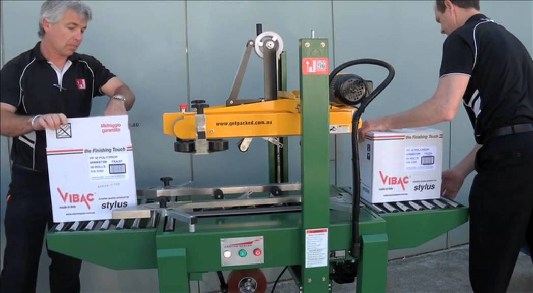 Carton sealer Top and Bottom drive taping machine - YouTube