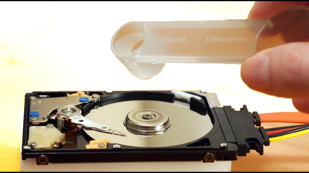 Dropping water on open hard disk running - how long will it last? - YouTube