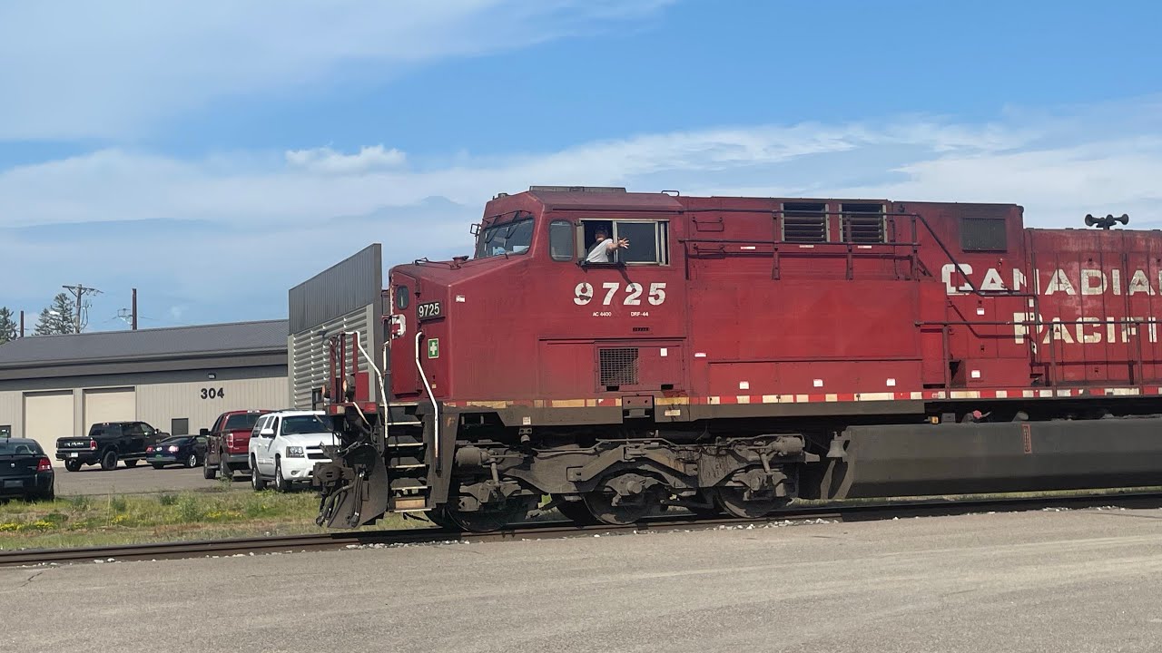 CP 9725 and KCS 4583 lead a Westbound Oil train with added on grain ...