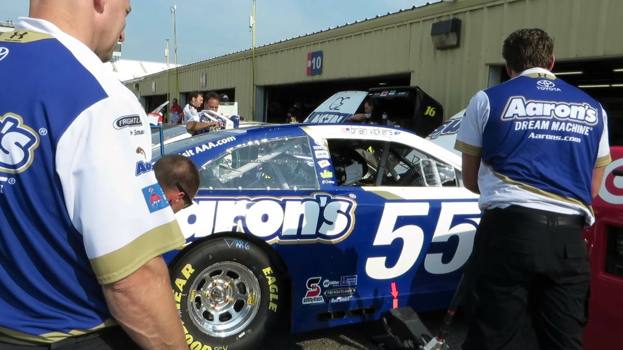 #55 Aaron's team working on Brian Vickers' car in the garage area - YouTube