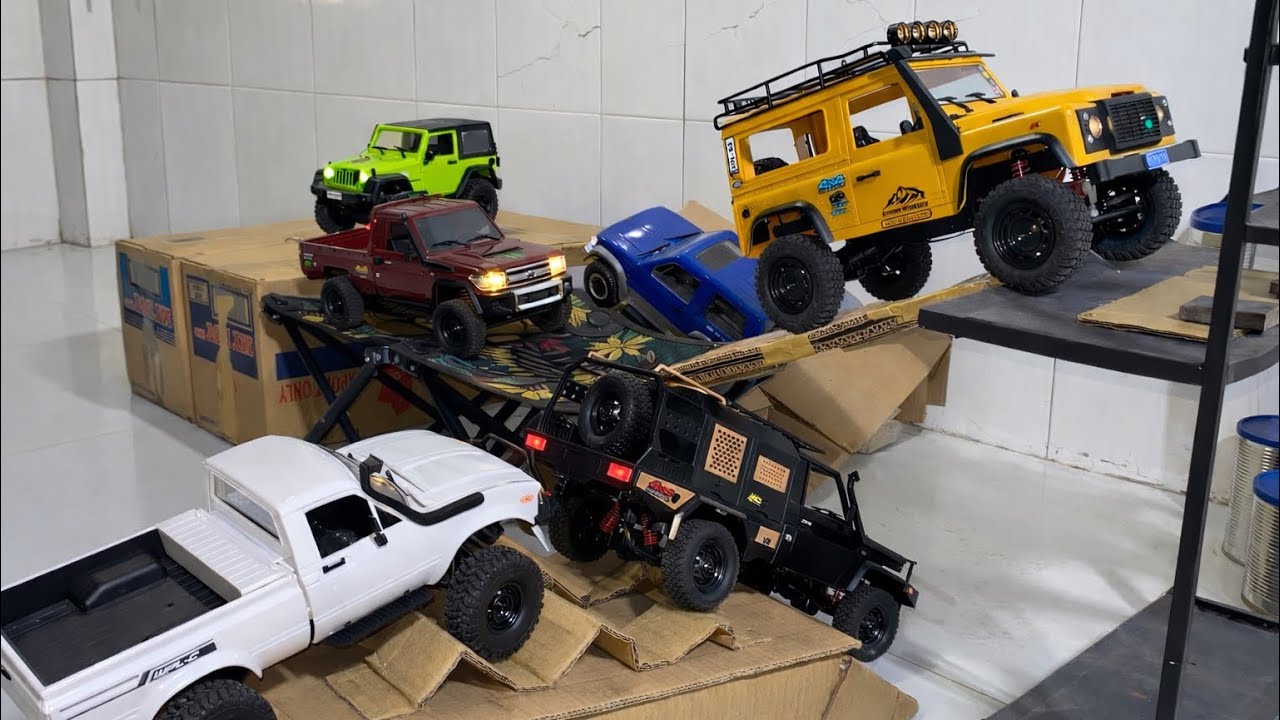 Realistic RC Off-Road Crawlers Taking on Cardboard Mountain Challenges ...