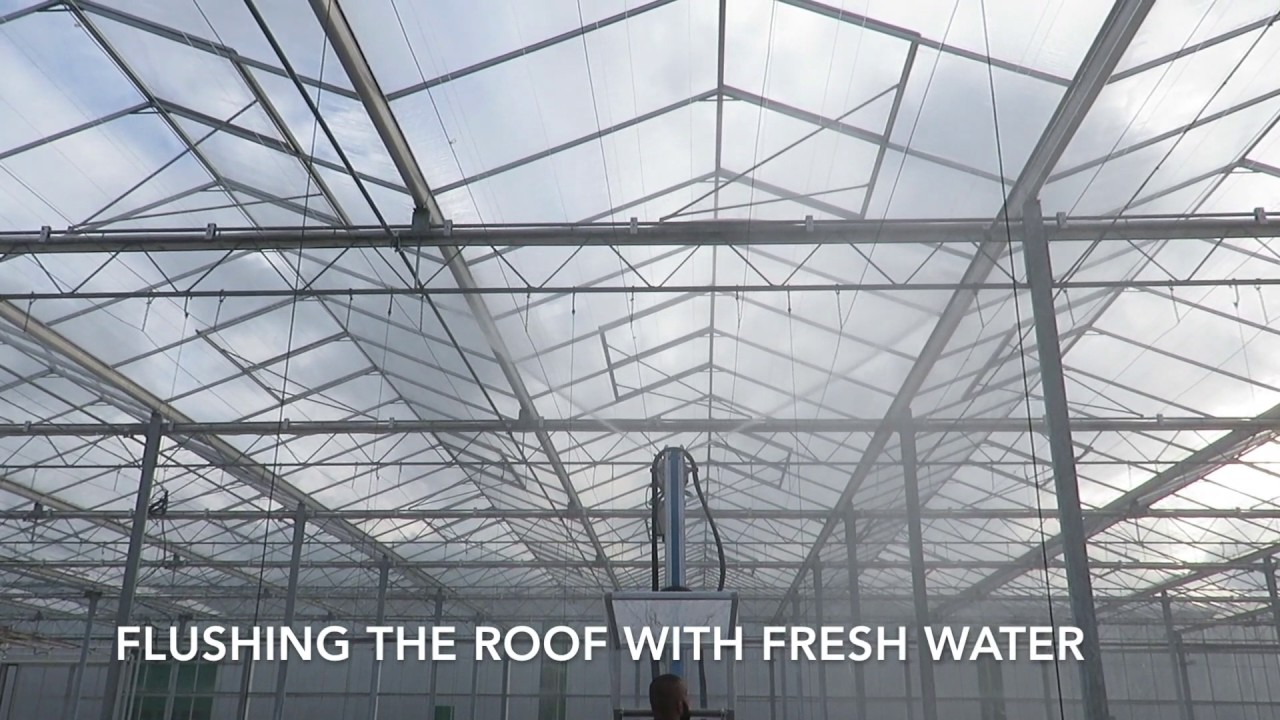Cleaning the interior of a greenhouse with the AquaJet roof washer ...