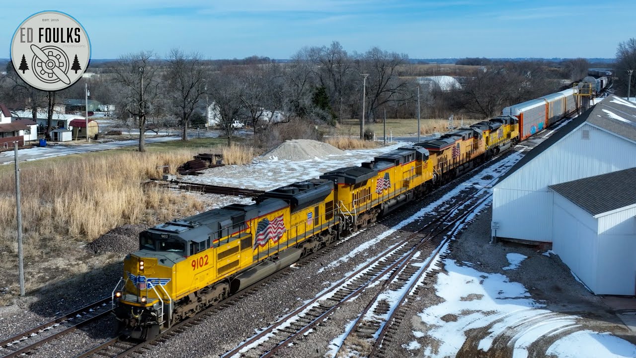 UP manifest stops on the main at Centerview while the westbound Amtrak River Runner leap frogs ...