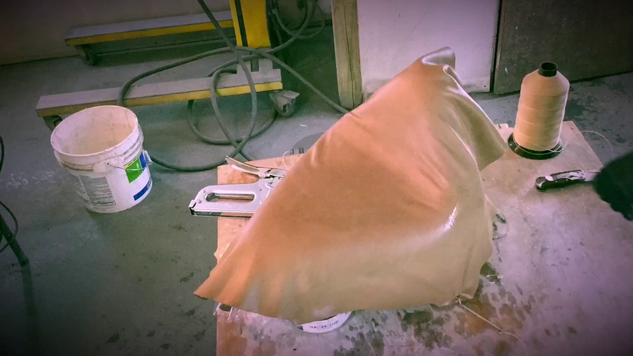 Custom motorcycle seat: stretching the base layer leather. - YouTube