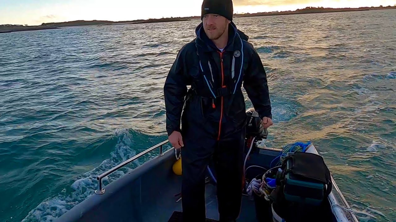 Hand pulling crab pots on a choppy day and bass fishing - YouTube