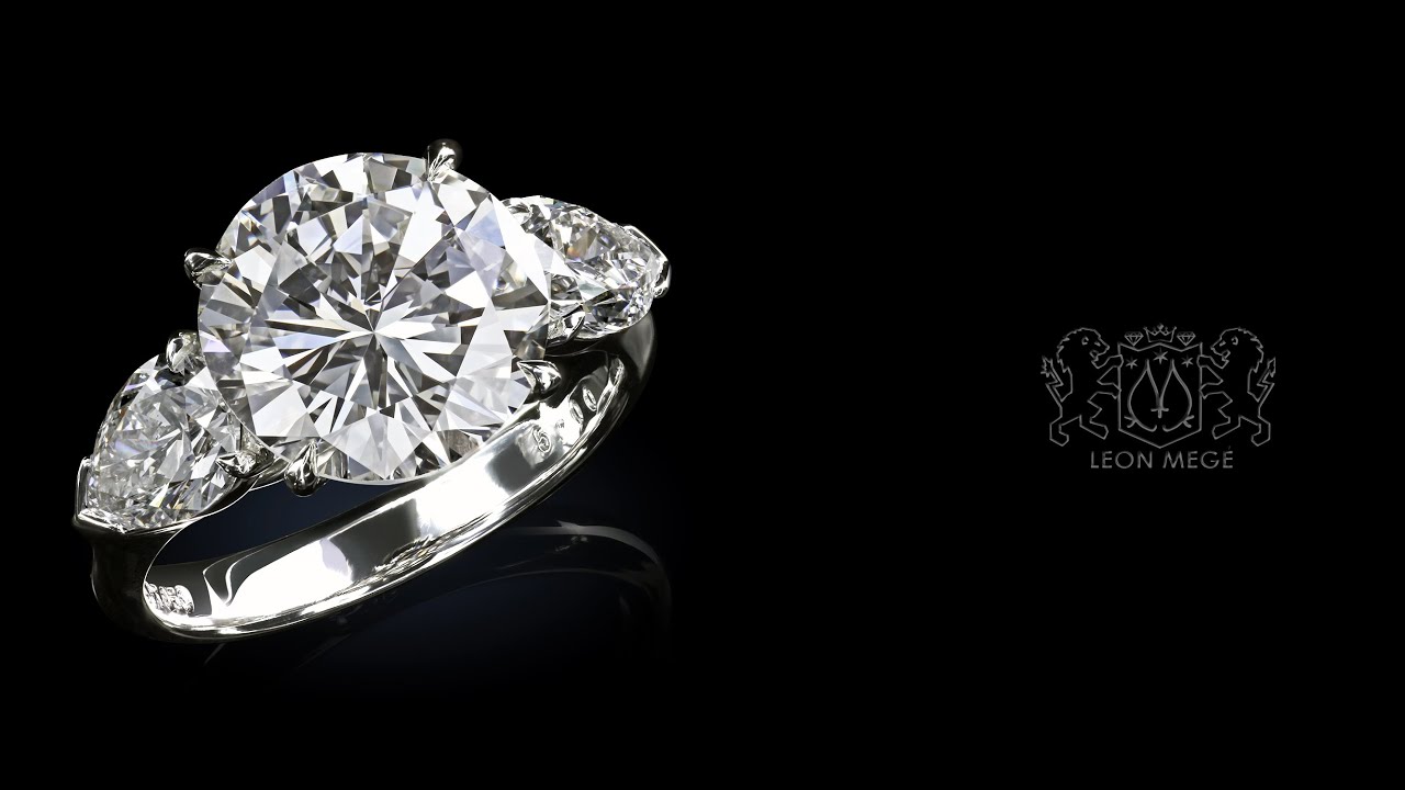 Leon Megé hand-forged classic three-stone ring with a round diamond and ...
