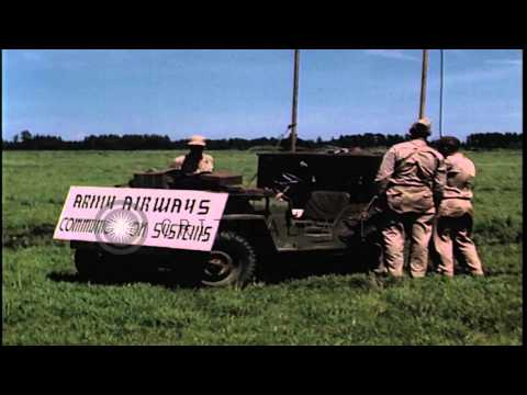 C-54 lands and enlisted men talk into microphone in Japan. HD Stock Footage