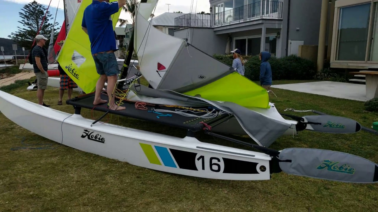 Brand new Hobie 16 raises sails first time - YouTube