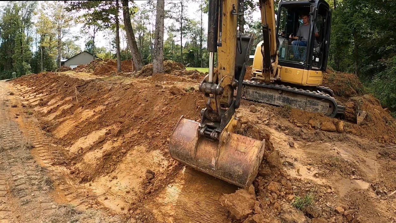 Re-Sloping a Failing Drainage Ditch with a CAT 304 Mini Excavator - YouTube