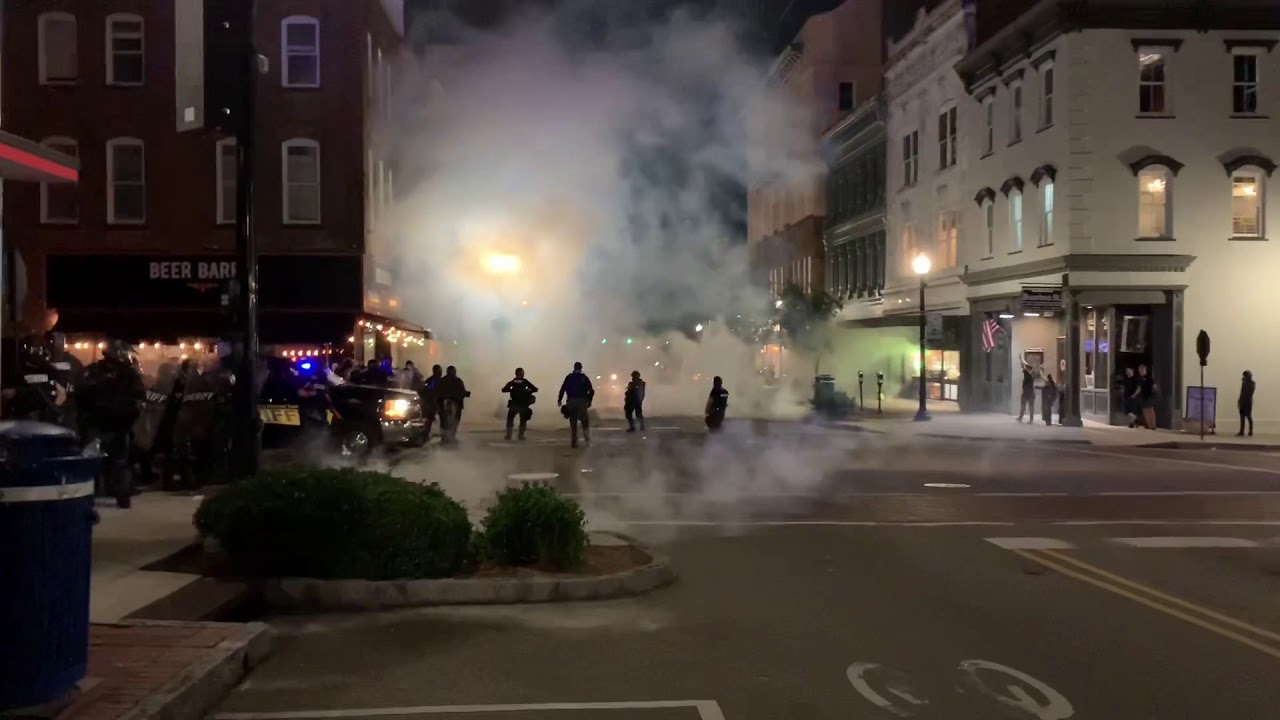 Police officers fire tear Multiple times that protesters along Front ...