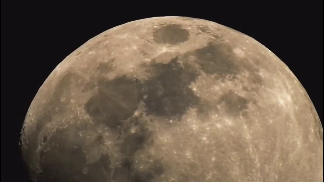 Disc shaped object flying across the moon - YouTube