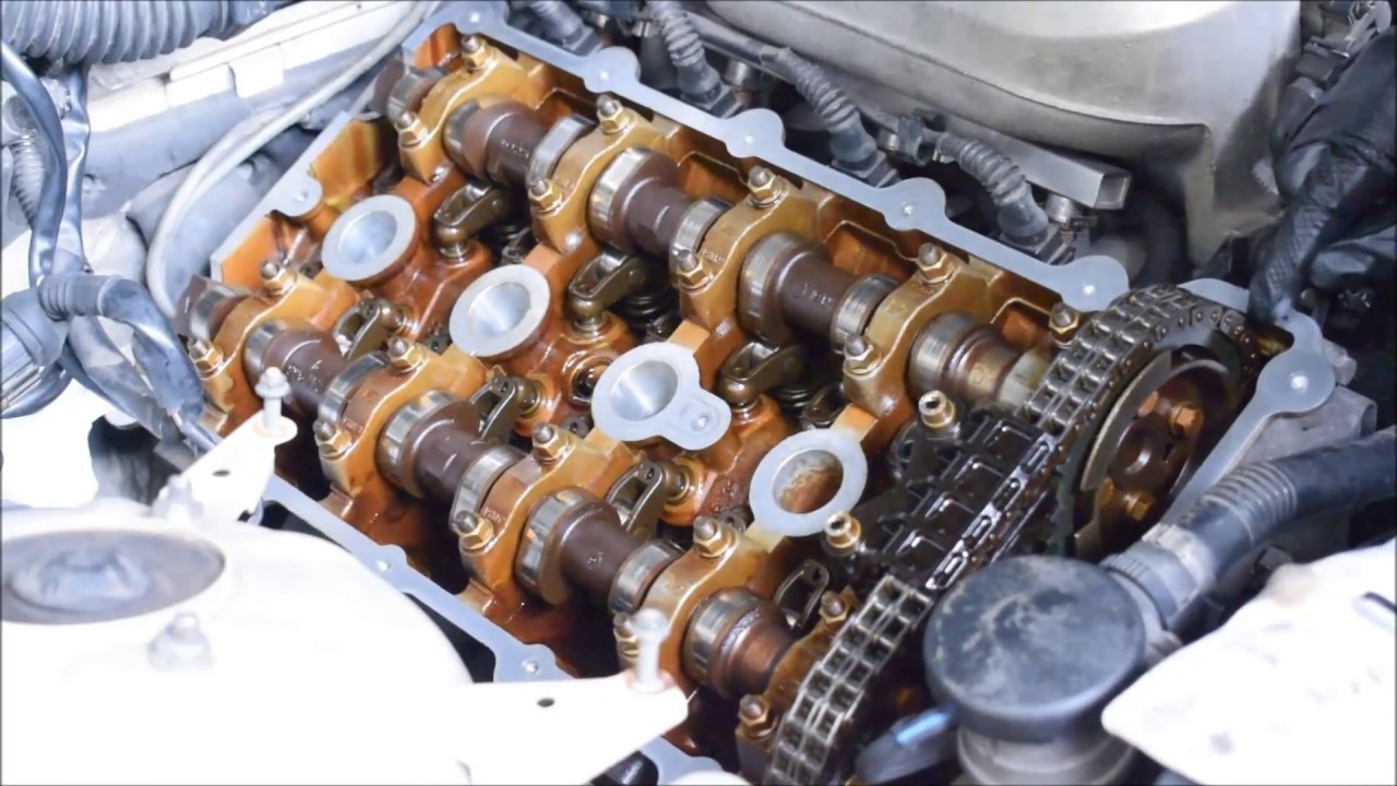 How to replace spark plug hole and valve cover gaskets on a BMW 318ti ...