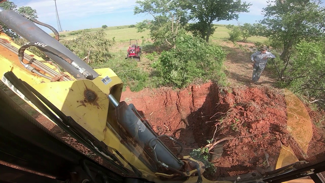 Dam busting with a backhoe, #digginok #backhoeman - YouTube