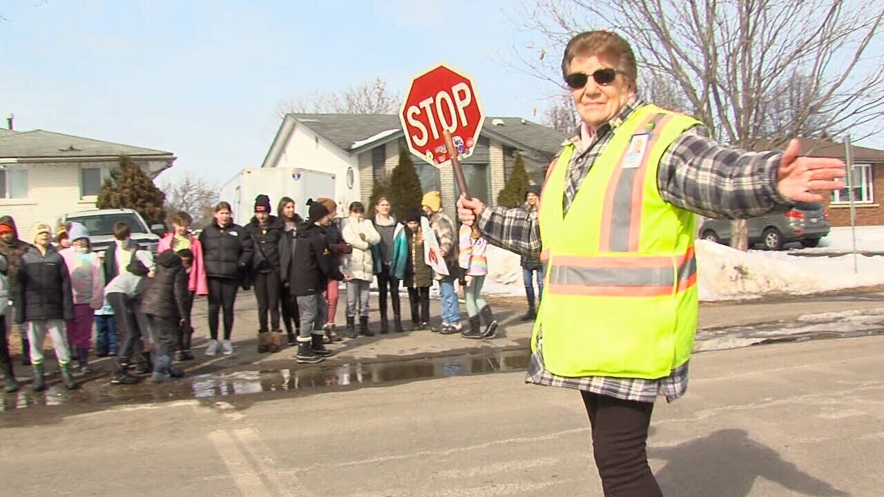 Local crossing guard honoured for long service - YouTube