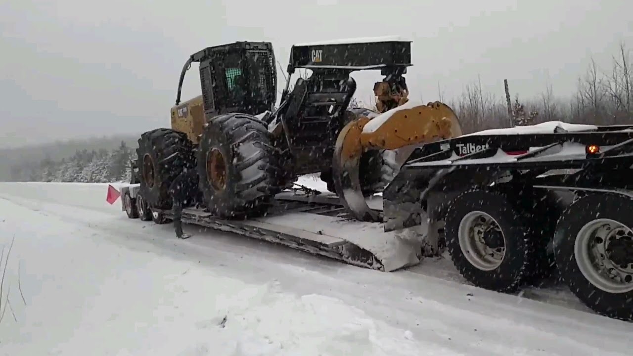 UNLOADING THE CAT 535D SKIDDER!!! - YouTube
