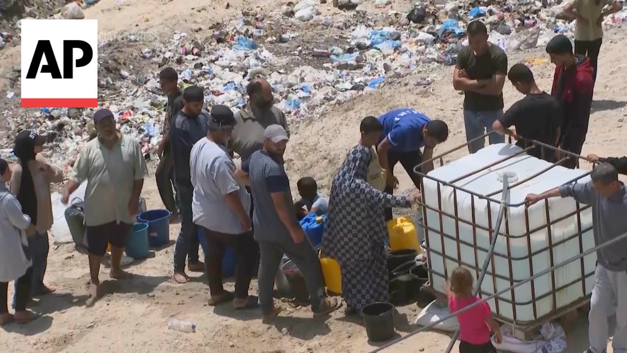 Water distributed in the Muwasi camp for displaced Palestinians in Gaza ...