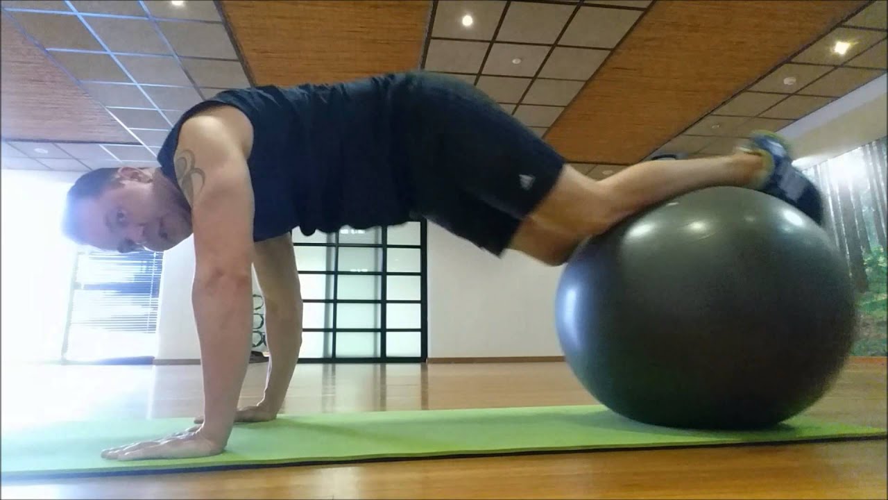 Stability ball knee tucks - snippet Shaun Green online personal ...