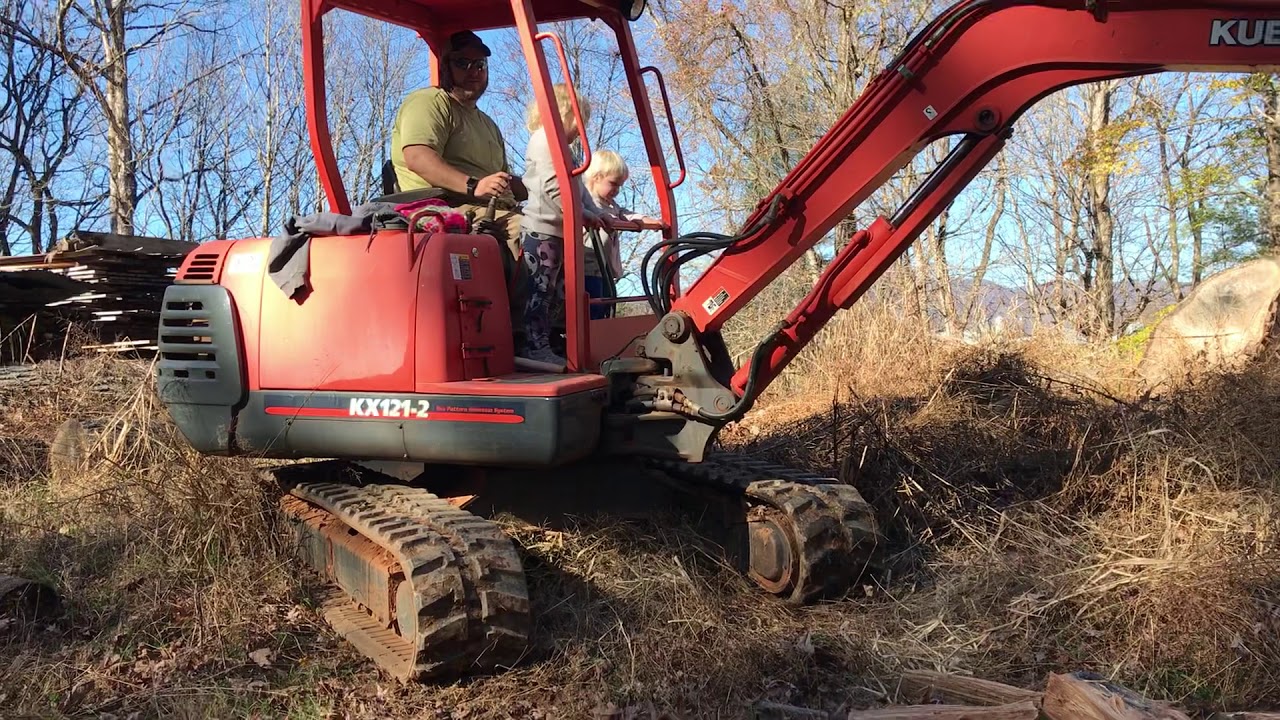 Excavator wood splitter - YouTube