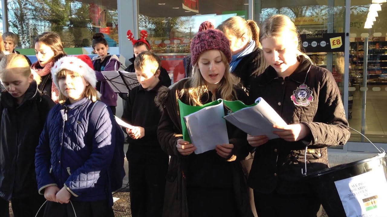 Hurst Carol Singers at the new Falcon Garage, Tadley - YouTube