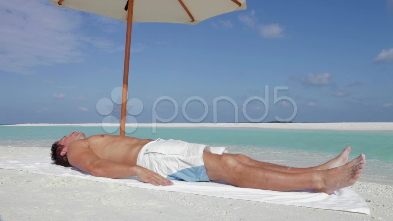 Man Sunbathing On Beach Holiday. Stock Footage - YouTube