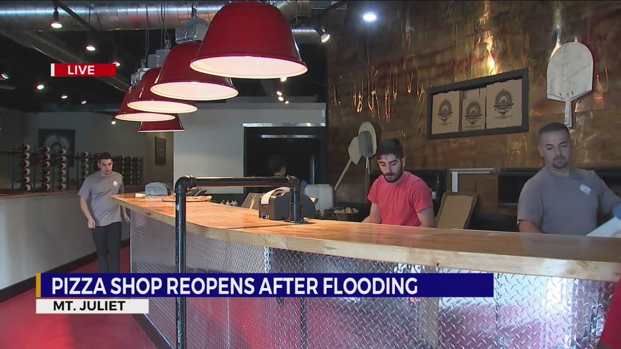 Pizza shop reopens after flooding - YouTube