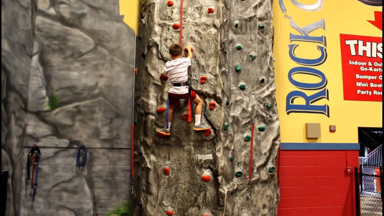 Kaleb climbing the rock wall - YouTube