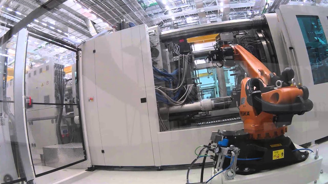 Robot extracting parts from IMM - YouTube