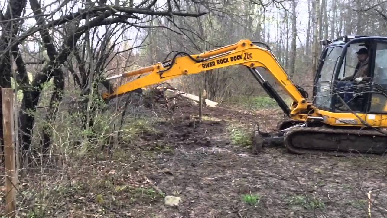 Clearing fence line with the excavator - YouTube