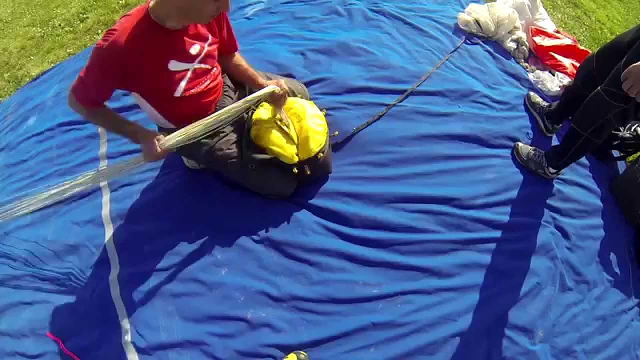 Flat packing a parachute - YouTube