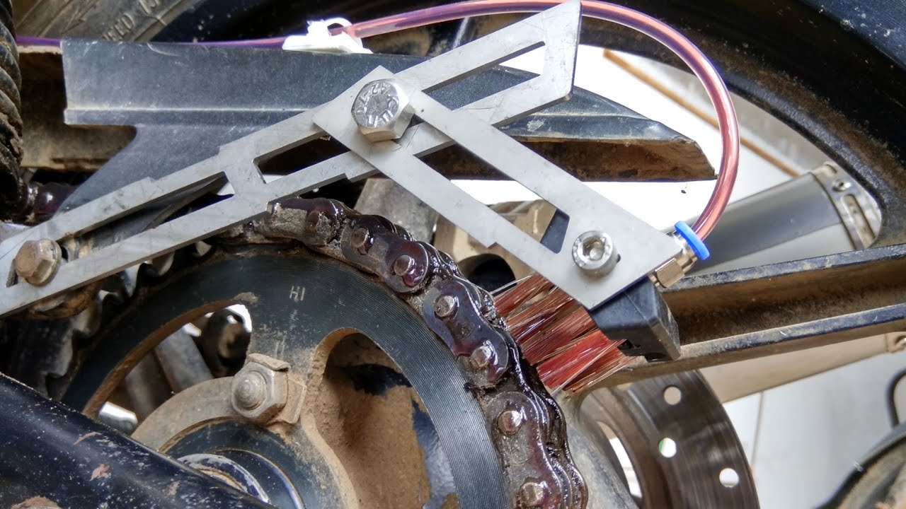 Automatic chain cleaner and oiler installation - YouTube