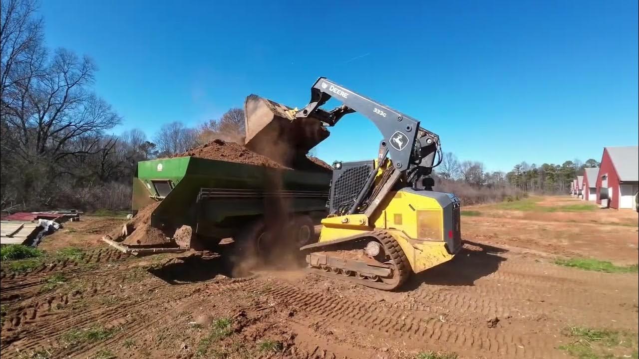 Moving poultry litter with the John Deere 6130 and John Deere 333G. Chandler Spreaders! - YouTube