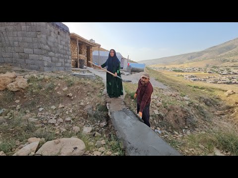 Next to the growing garden; how did Ahmad rebuild the small mountain bridge?