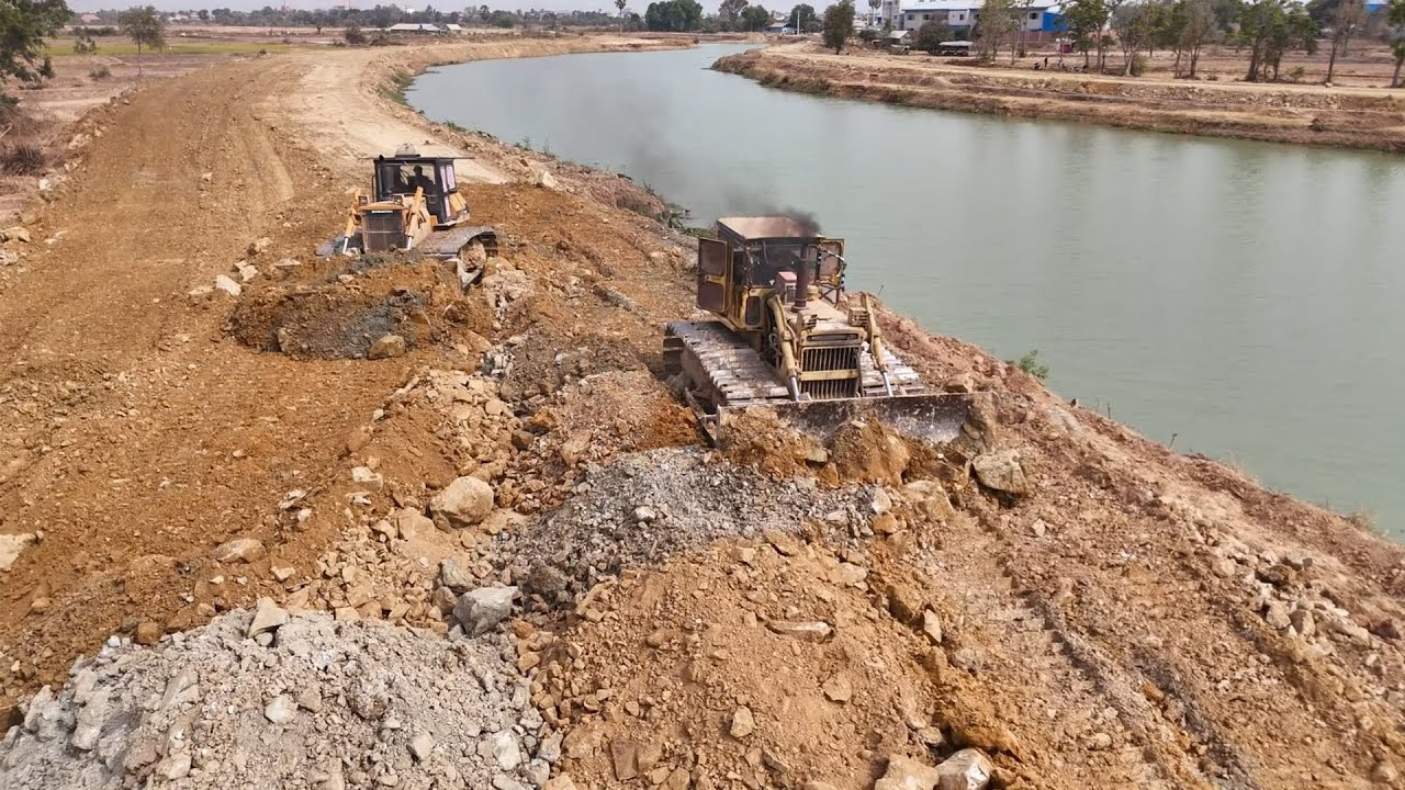 Beautiful view of the road construction process along the canal by ...