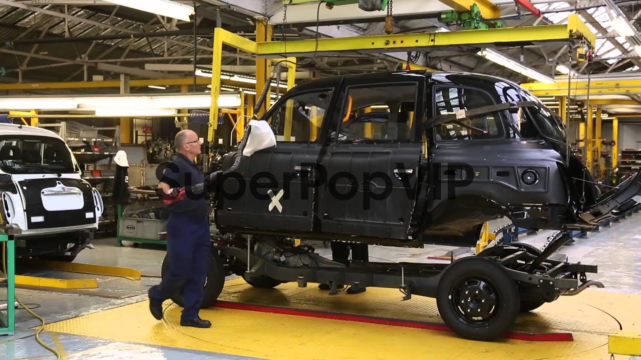 Long Shot, Workers inside the factory of The London Taxi ... - YouTube